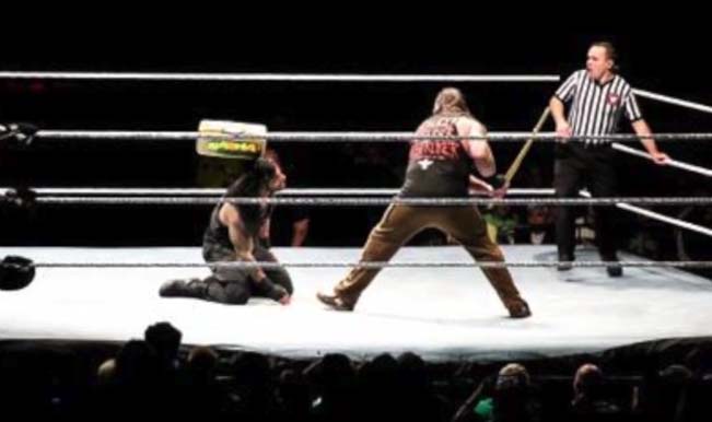 Roman Reigns attacked by WWE fan with Money In The Bank briefcase ...