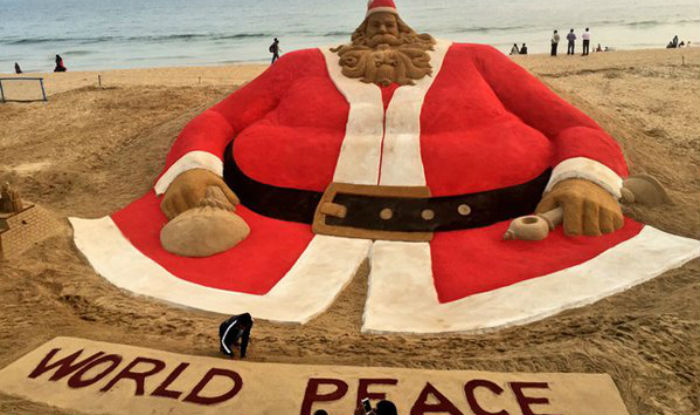 World’s ‘tallest’ sand Santa Claus stands at Puri beach | India.com