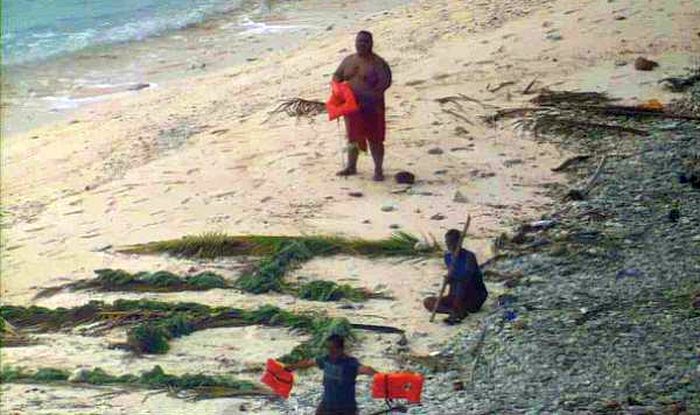 Three men stranded on island write HELP on sand, get spotted by a Navy ...
