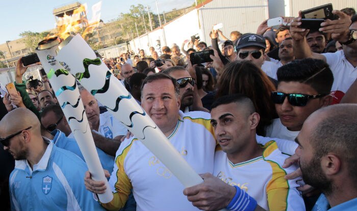 Rio Olympics 2016: Syrian athlete carries torch in Greek refugee camp ...