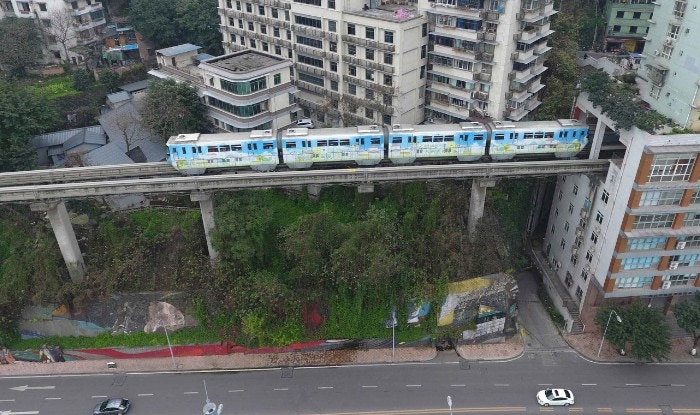 Train arrives to pick passengers from this building in China’s ...