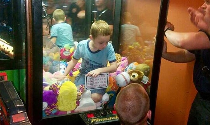 Boy Gets Stuck Inside an Arcade Machine When he Climbed to Get ...