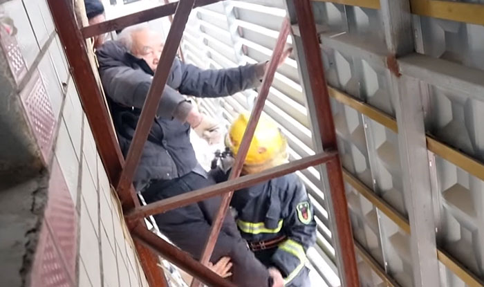 Elderly Man Falls From Balcony, Gets Stuck in Advertising Hoarding ...
