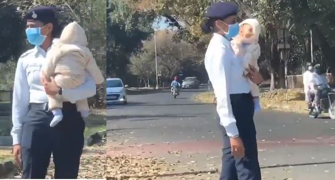 Video of a Woman Traffic Constable Holding Baby on Duty Goes Viral ...