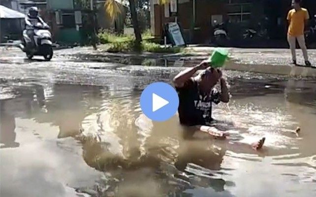 Viral Video of Man's 'Bathing' and 'Fishing' in Giant Pothole Forces ...