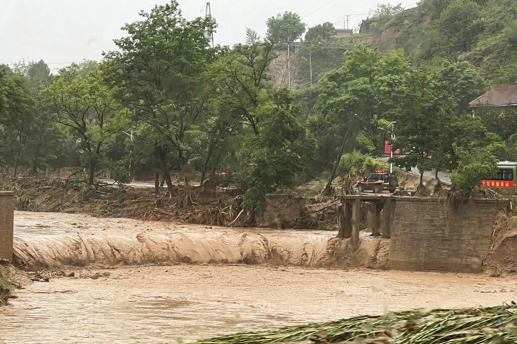 Flash Floods In China Leave At Least 12 Dead, Thousands Evacuated