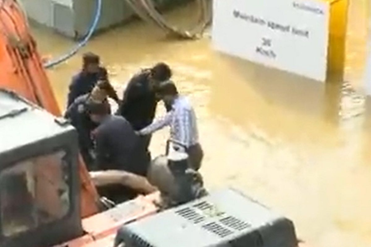 Bengaluru Rains: Security Guards Rescue Man Stuck On Waterlogged Road | Watch Video