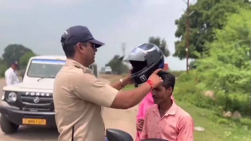 Viral Video: Police Officer Responds to Man Riding Bike Without Helmet ...