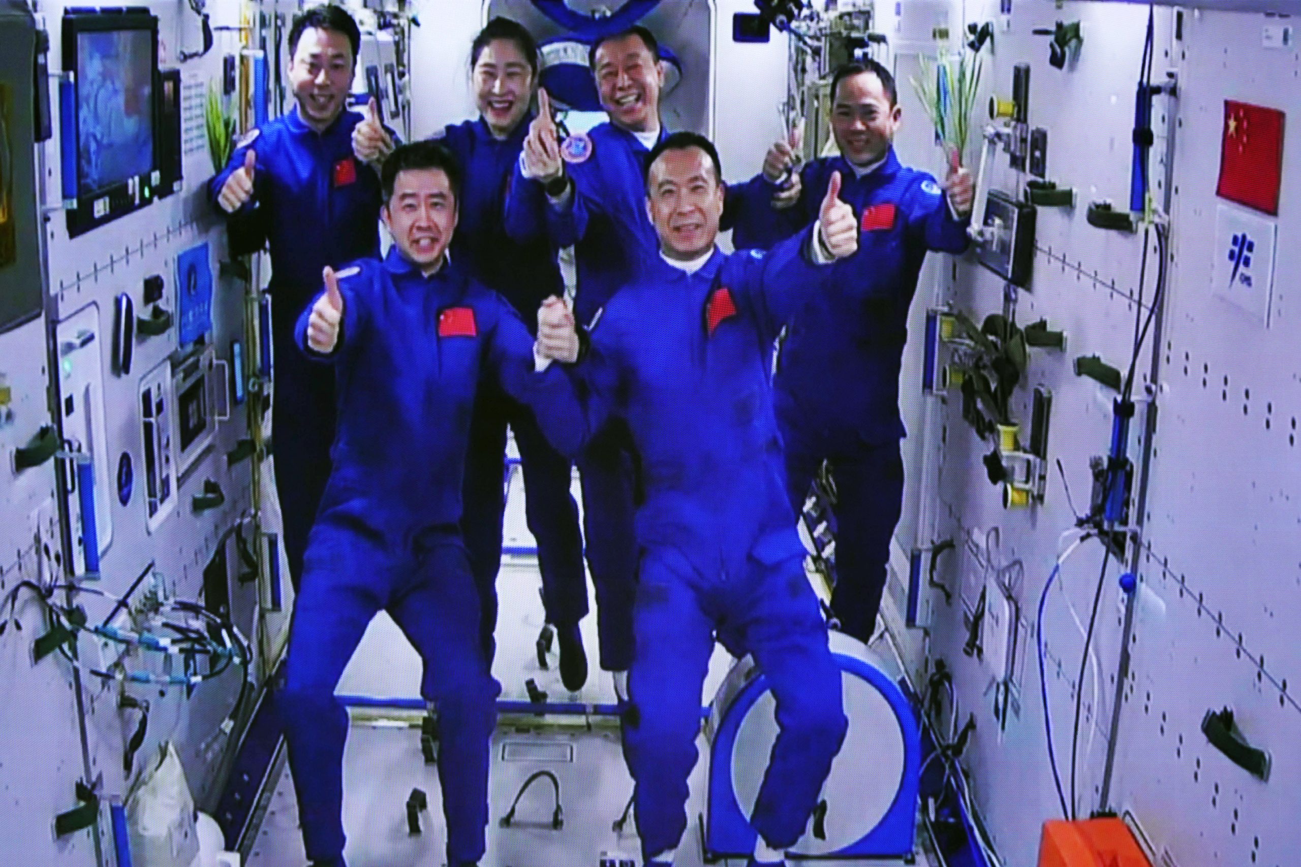 Chinese Spaceship with 3 Aboard Docks with Space Station