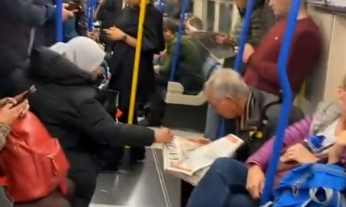 Stranger Holds Newpaper For Old Man During Train Ride. Video Goes Viral ...