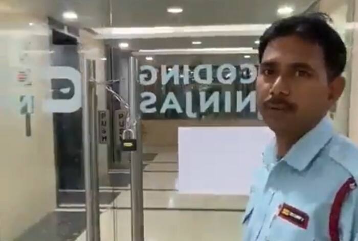 Netizens Outrage As Video Showing Watchmen Locking Employees Goes Viral