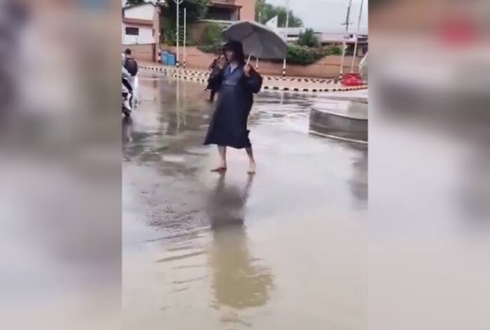 Watch: Kashmir Cop Manages Traffic Barefoot Amid Heavy Downpour In ...