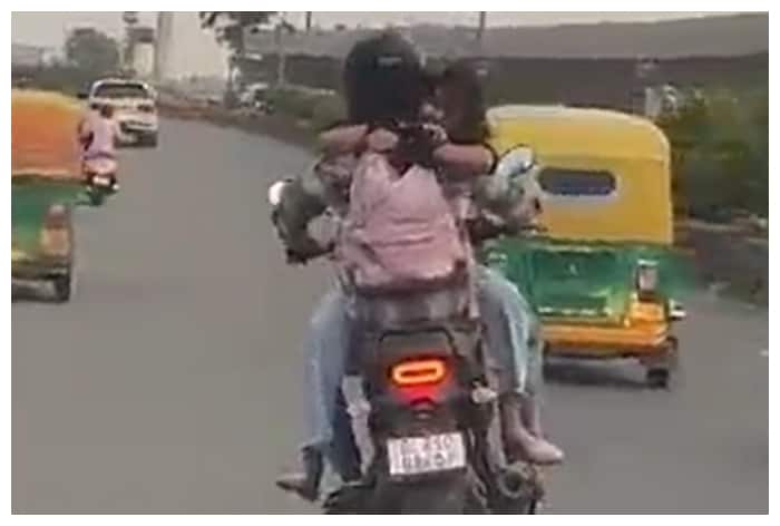 Video Of Couple Getting Intimate On Bike Goes Viral, Delhi Traffic Police React