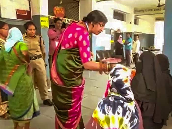 Watch Bjps Madhavi Latha Checks Voter Id Of Burqa Clad Muslim Women