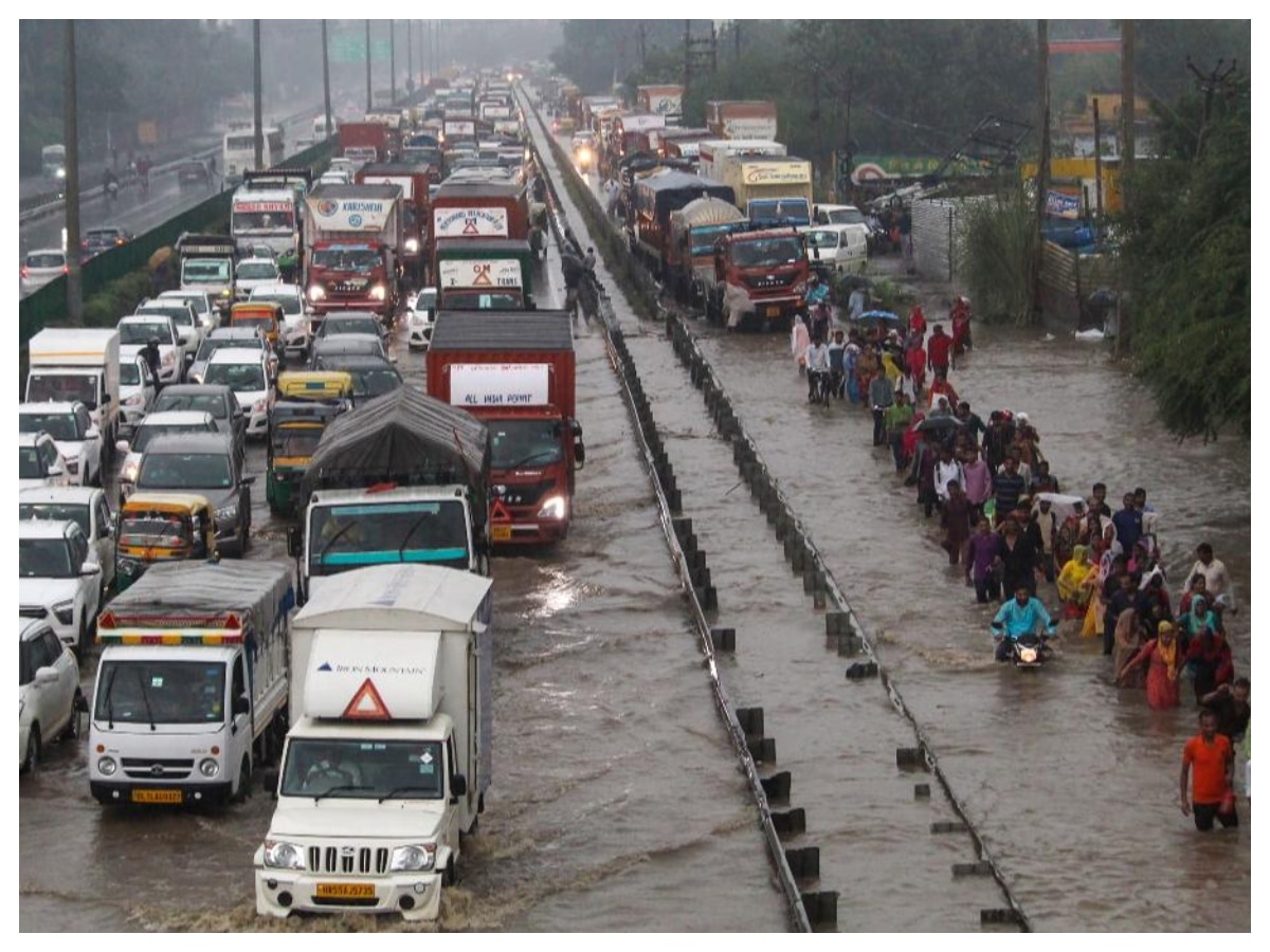 Delhi Rain Throws Life Out Of Gear: Traffic Crawls, Cars Seen Submerged ...