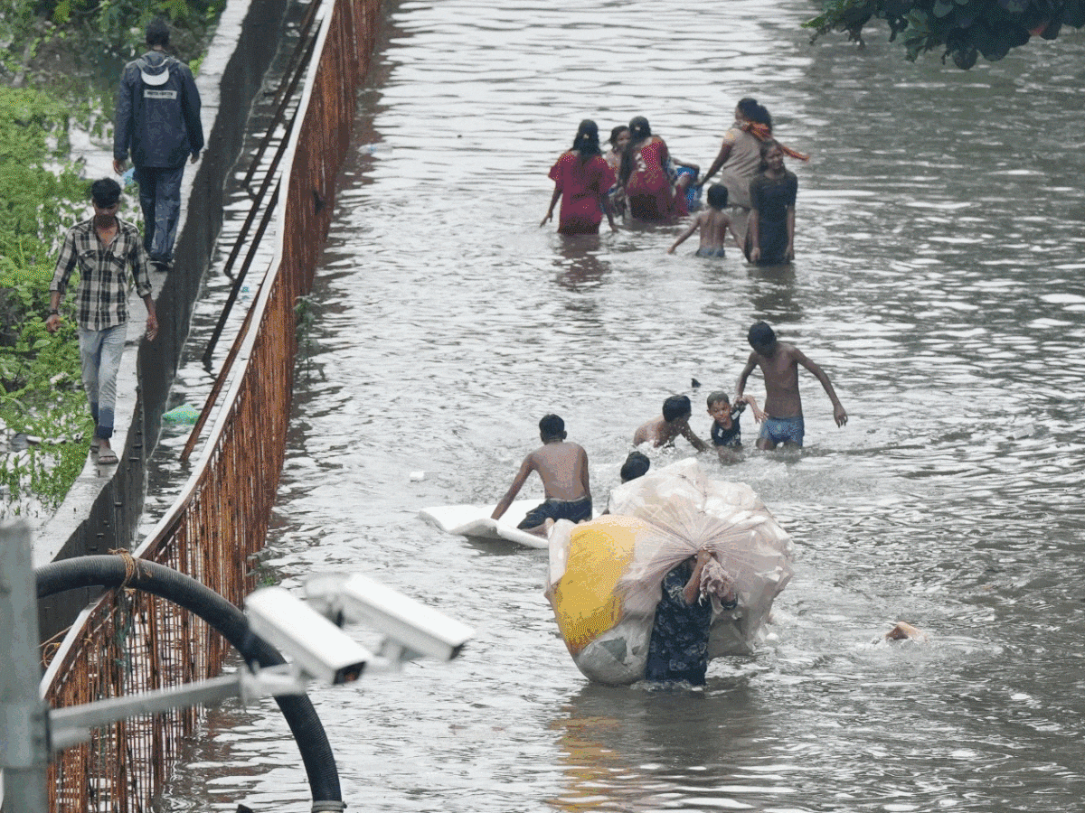 Mumbai Rain: City Waterlogged After Overnight Showers, 51 Flights ...